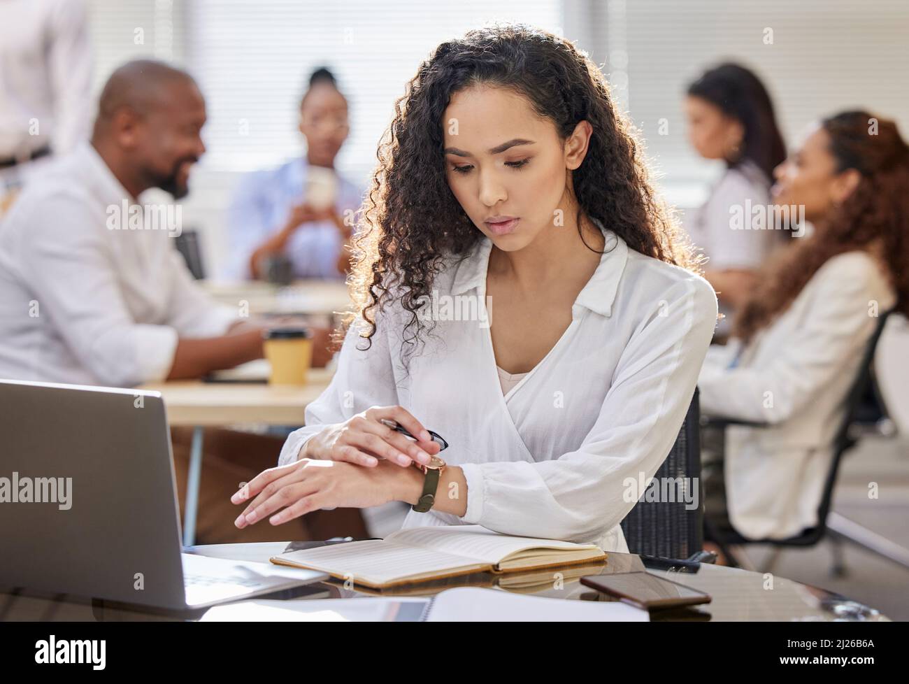 Woman checking clock office hi-res stock photography and images - Alamy