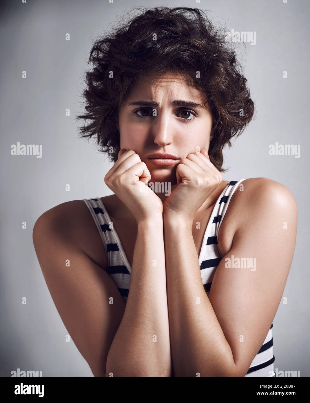 Im too scared to do that. Studio portrait of an attractive young woman ...