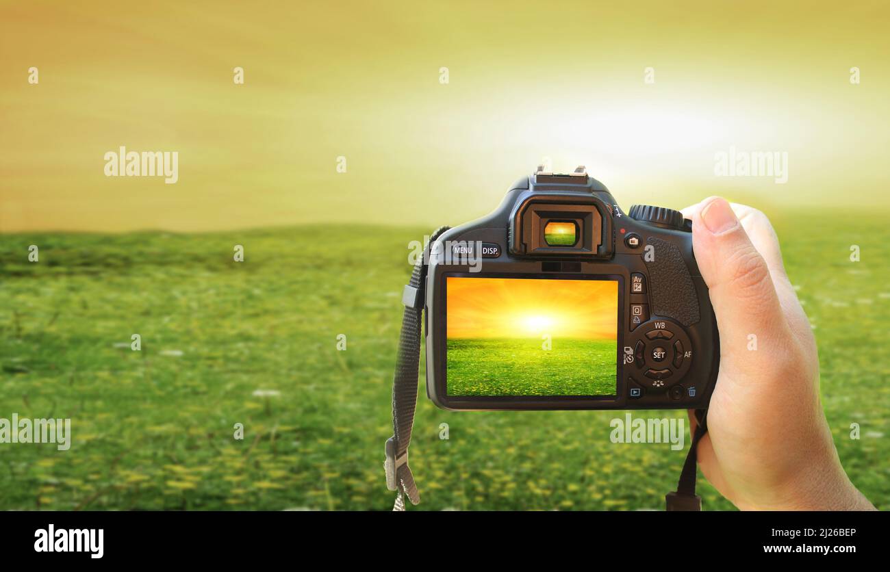 Photographer with camera at work Stock Photo - Alamy