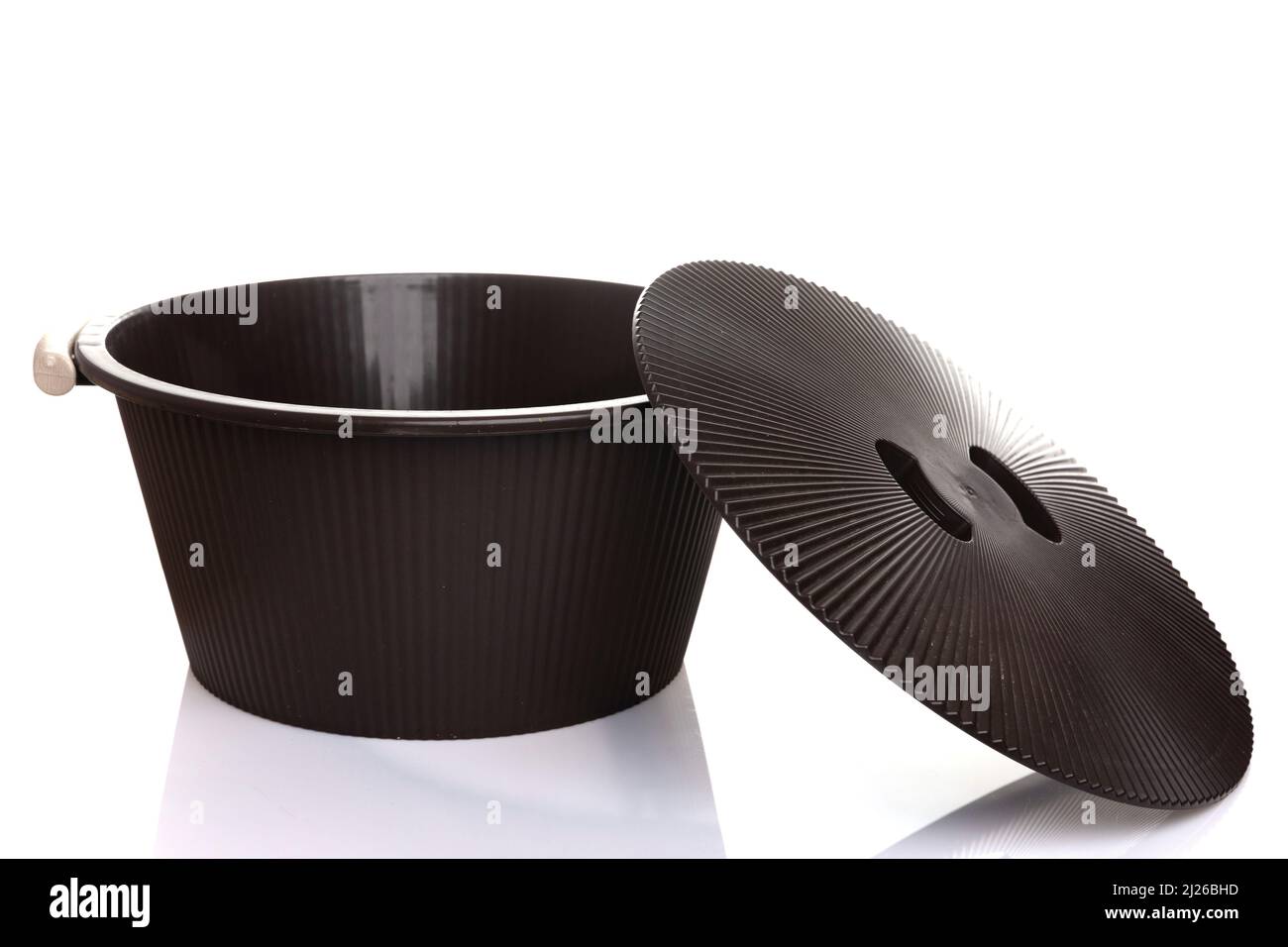 round plastic brown container with handles and lid isolated on white ...