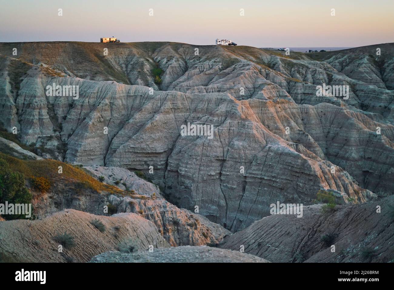 A view of sharply eroded buttes and pinnacles in Badlands National Park ...