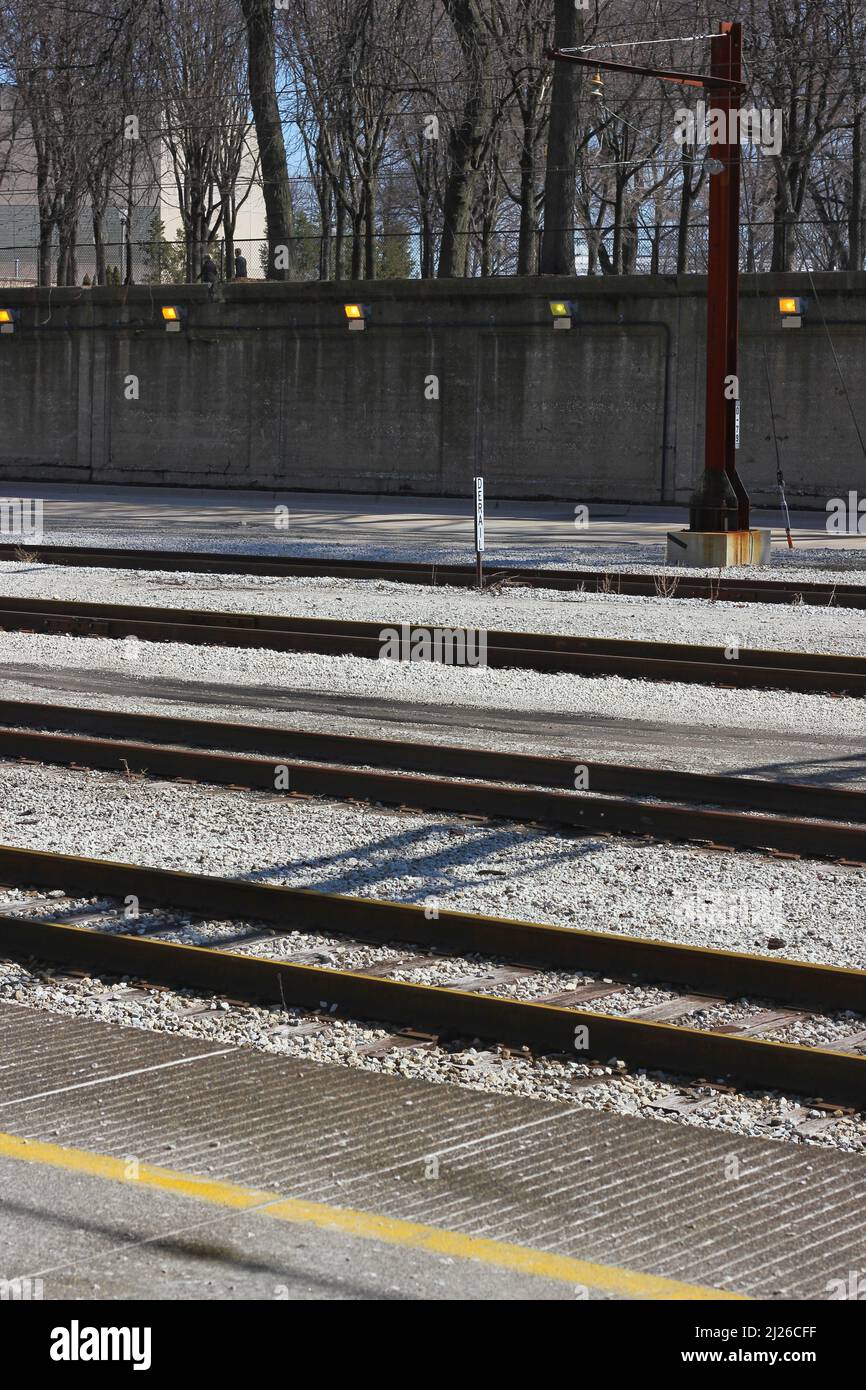 Railroad tracks at the local public train station Stock Photo - Alamy