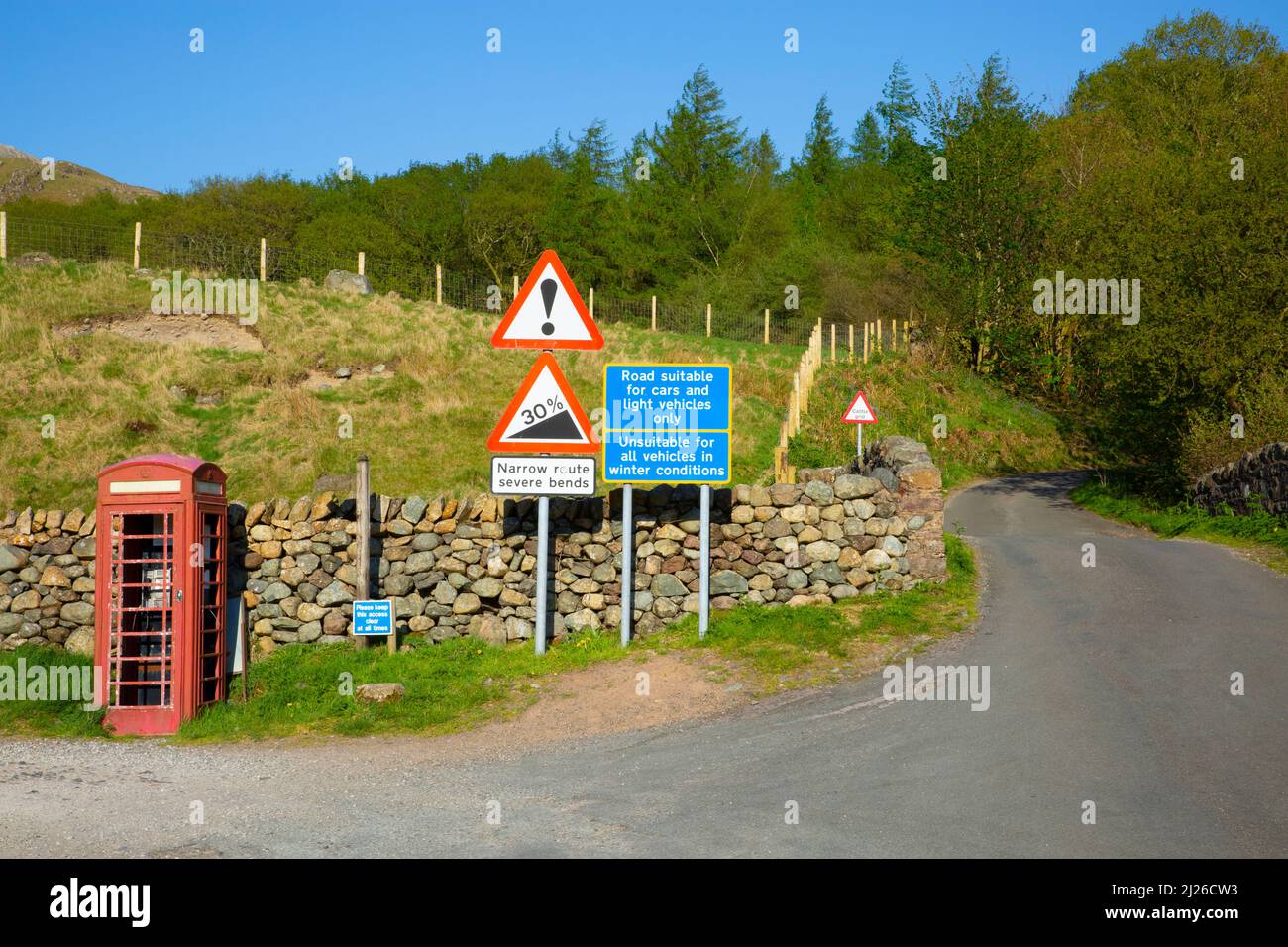 A gradient road sign shows 30% at the bottom of Hardknott Pass looking ...