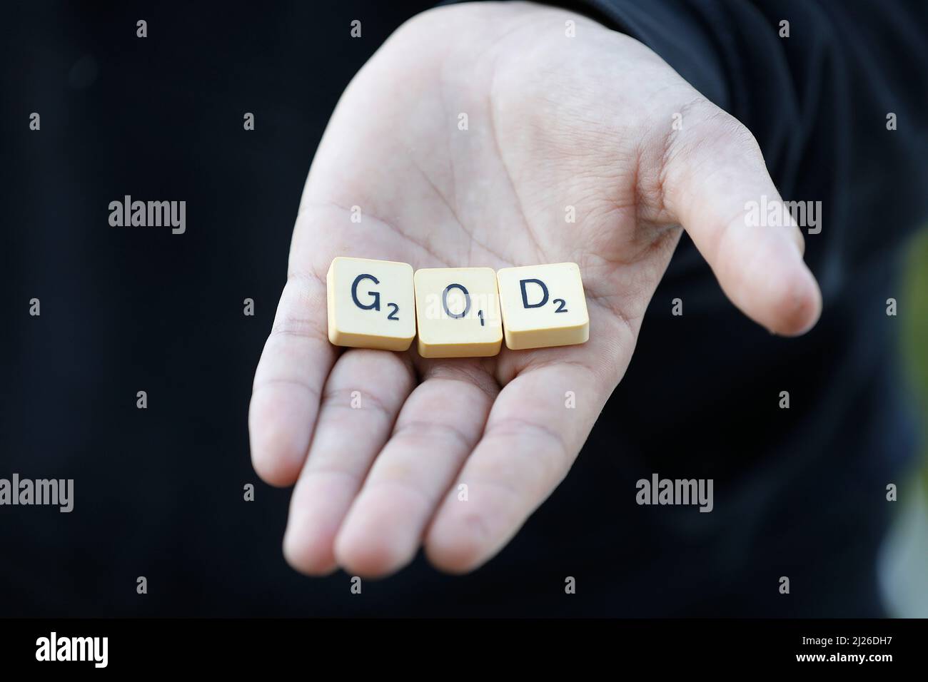 Boy showing letters spelling God. Eure, France Stock Photo - Alamy
