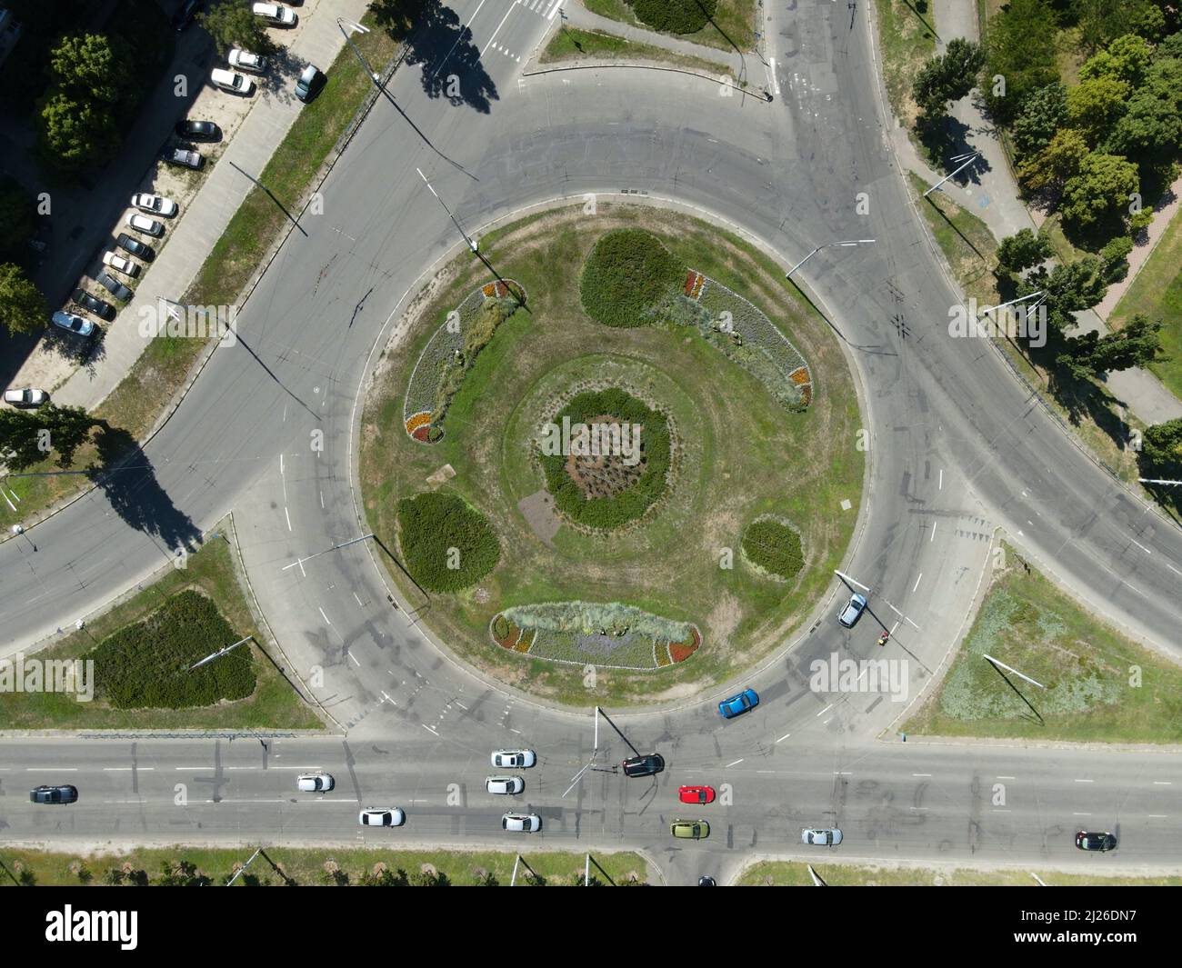 A top view of a roundabout road with a park in the middle Stock Photo ...