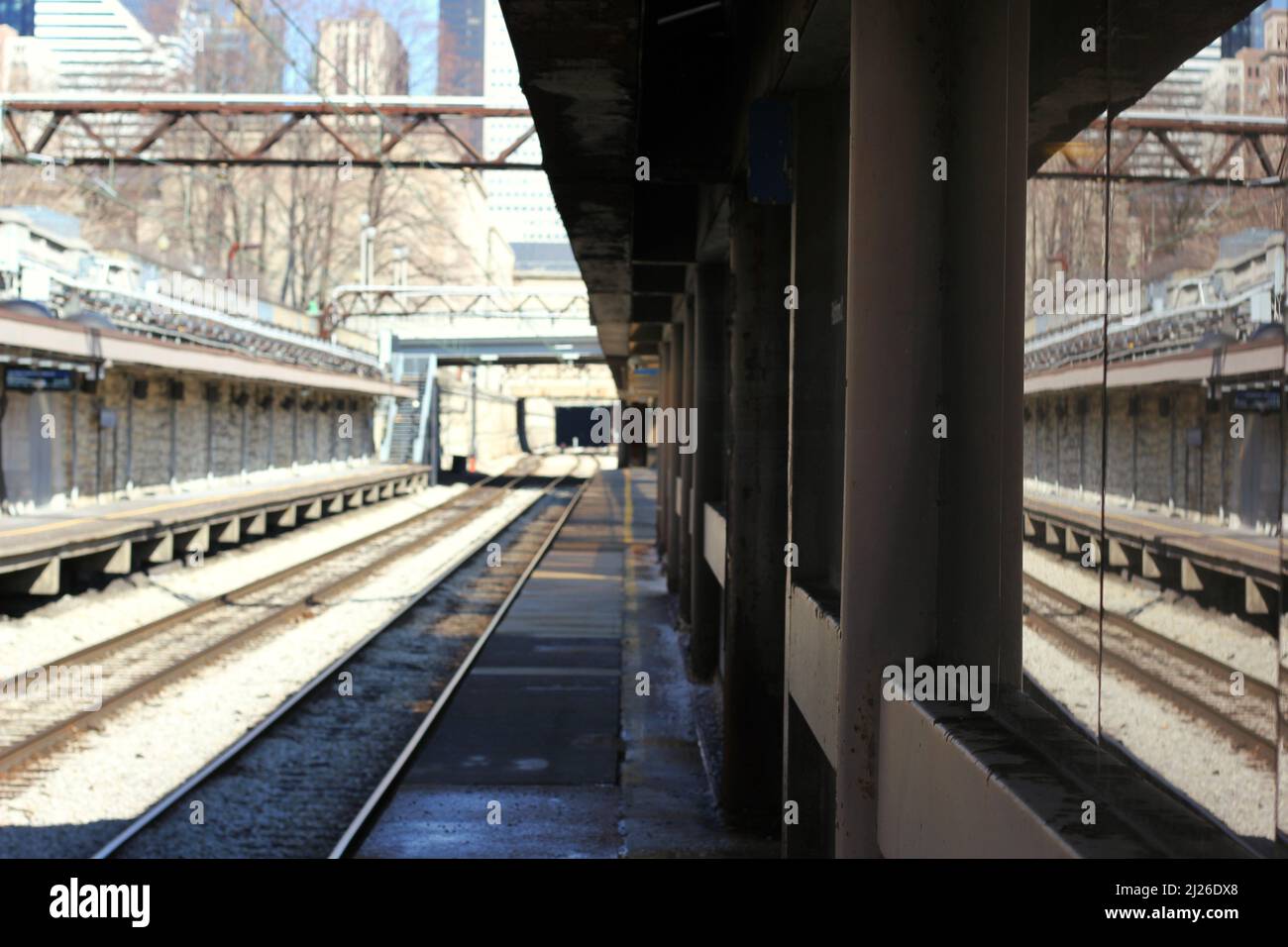 Railroad tracks at the local public train station Stock Photo - Alamy