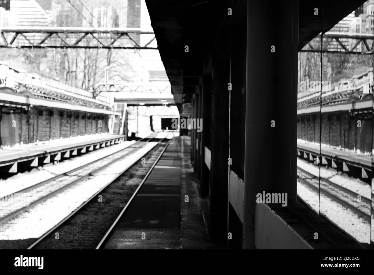Railroad tracks at the local public train station Stock Photo - Alamy