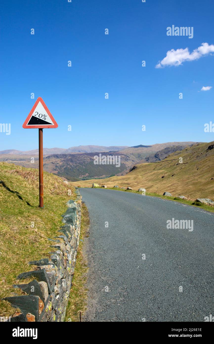 A gradient road sign shows 20% at the top of Honister Pass looking east ...