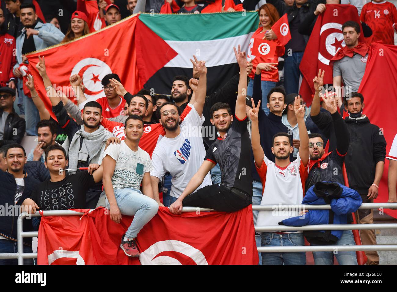 Tunis, Tunisia. 29th Mar, 2022. Tunisian supporters hold flags during ...