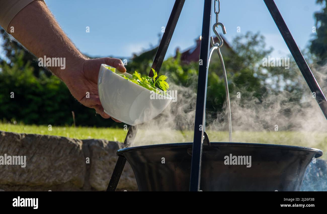 Cooking in the kettle over the fire bowl Stock Photo - Alamy
