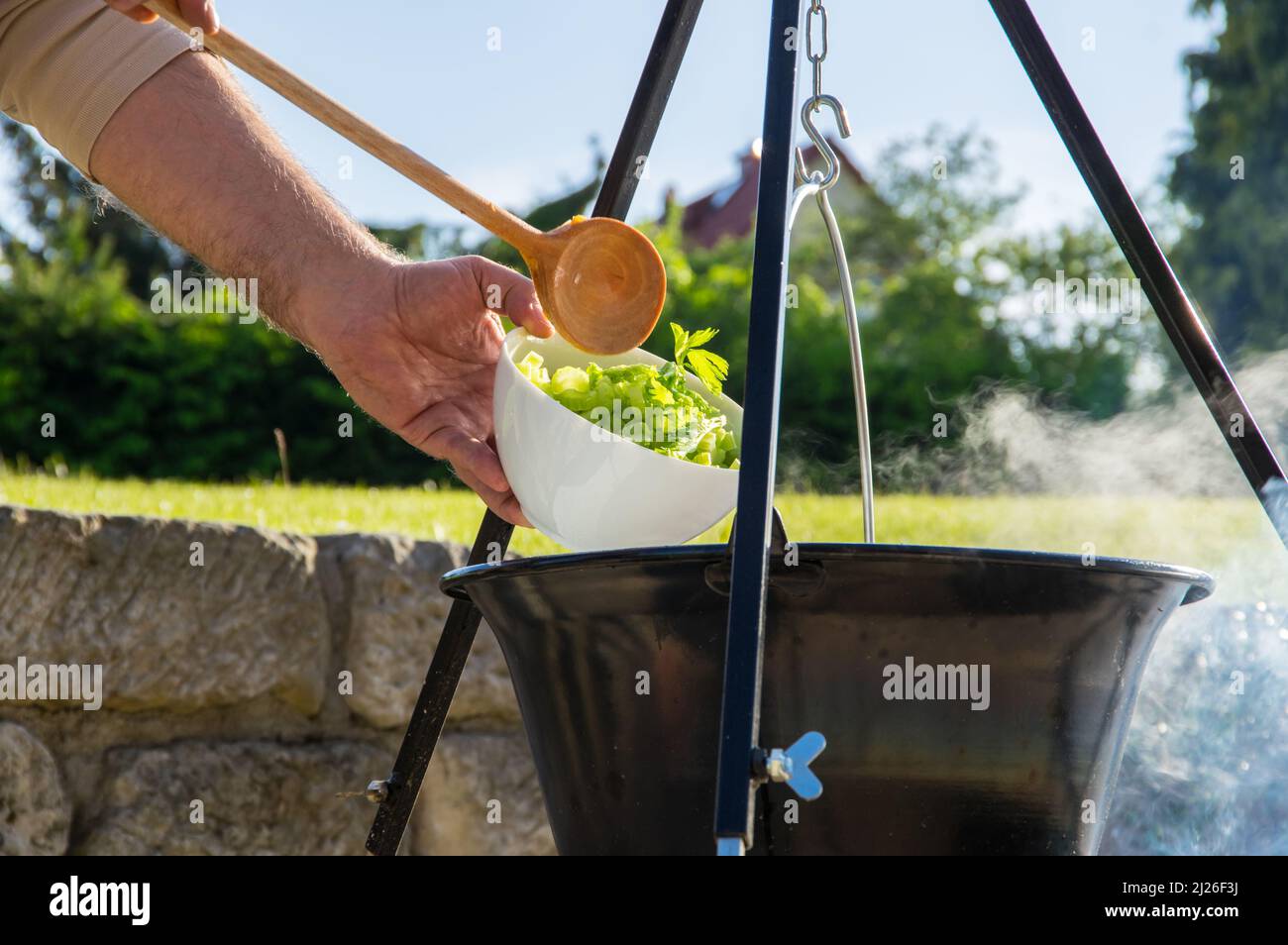 Cooking in the kettle over the fire bowl Stock Photo - Alamy