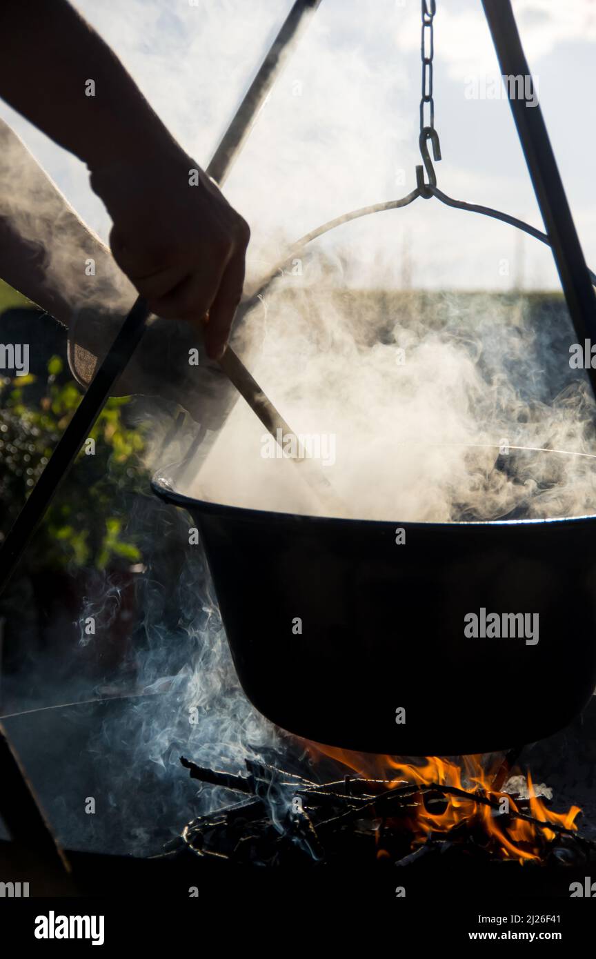 Cooking in the kettle over the fire bowl Stock Photo - Alamy