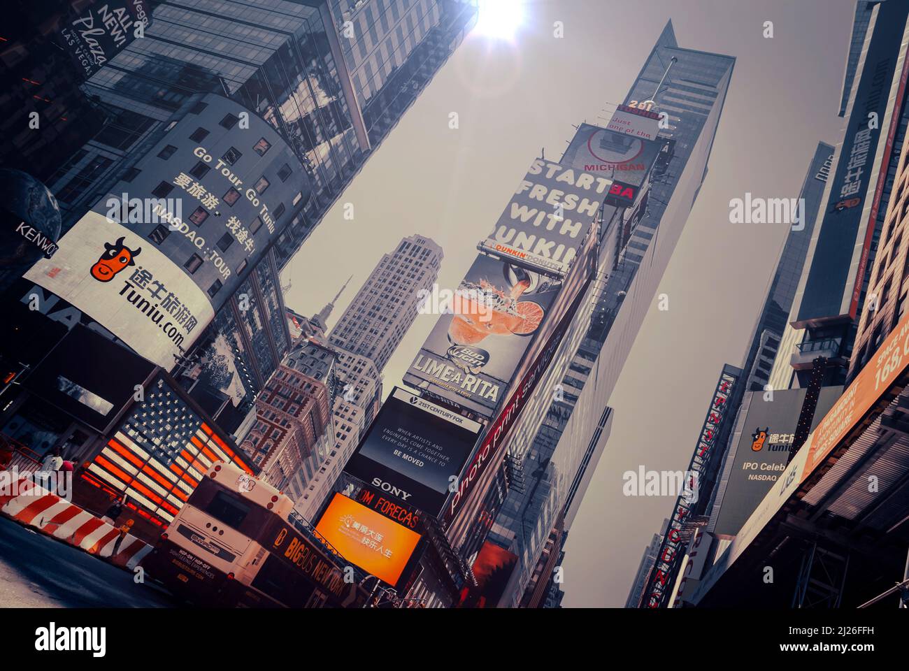 Electronic advertising billboards lining sides of the buildings on ...