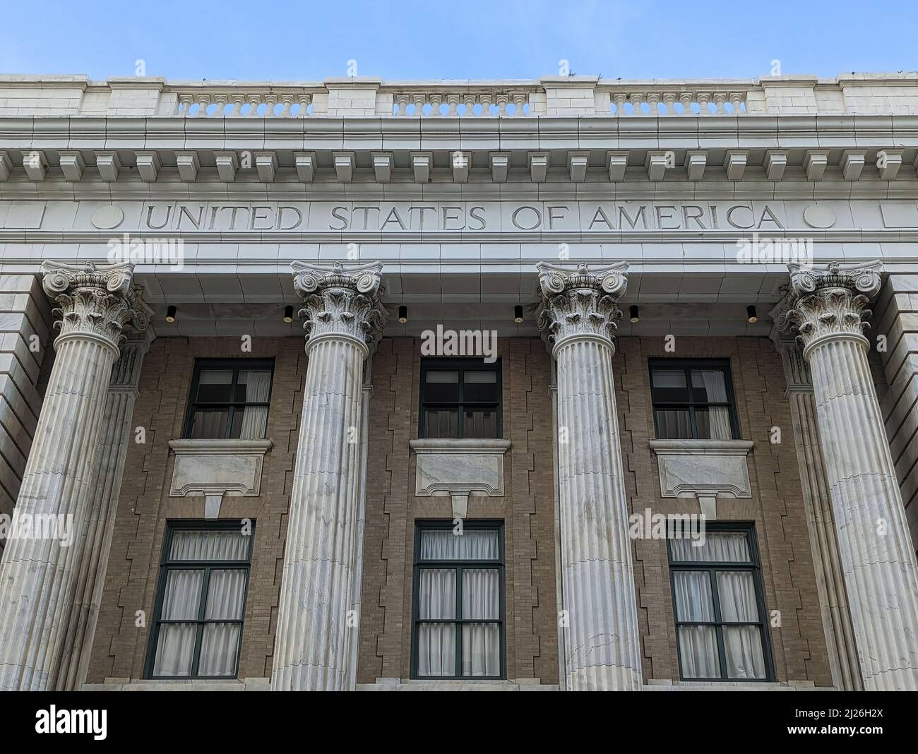 A low angle closeup of the Federal Reserve Bank with long columns in ...