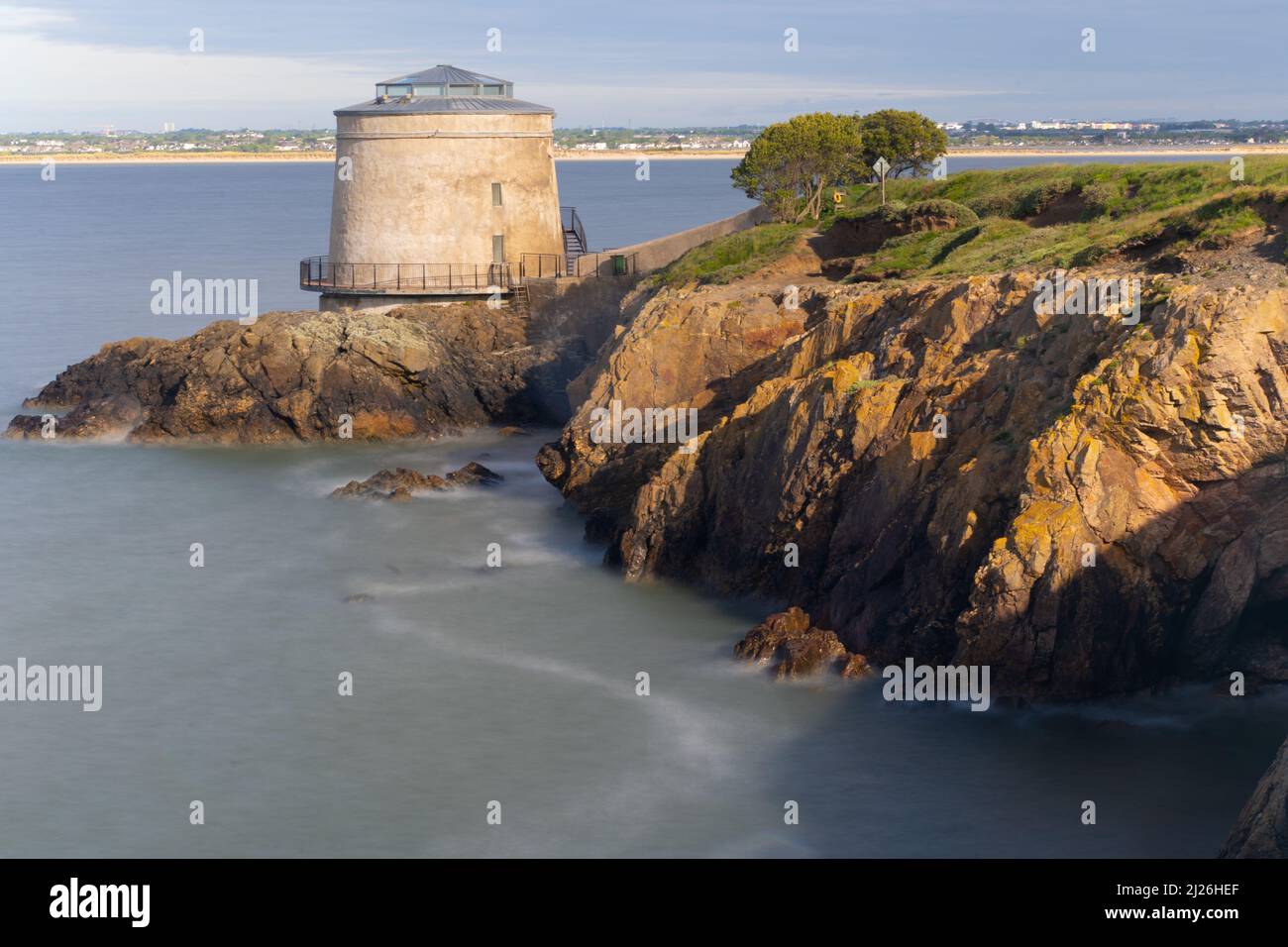 A beautiful view of a lighthouse next to the cliffs at the shore Stock ...