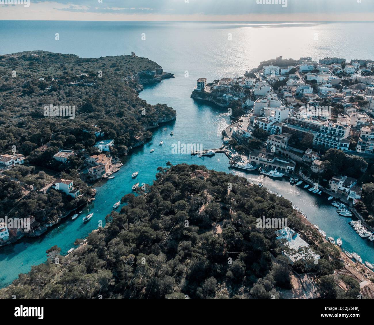 A scenic aerial view of boats and geological formations at the seashore ...