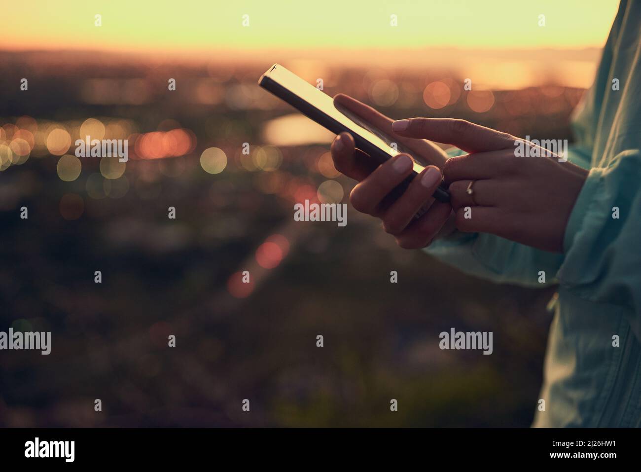 Still getting signal up here. Shot of an unrecognizable woman sending a ...