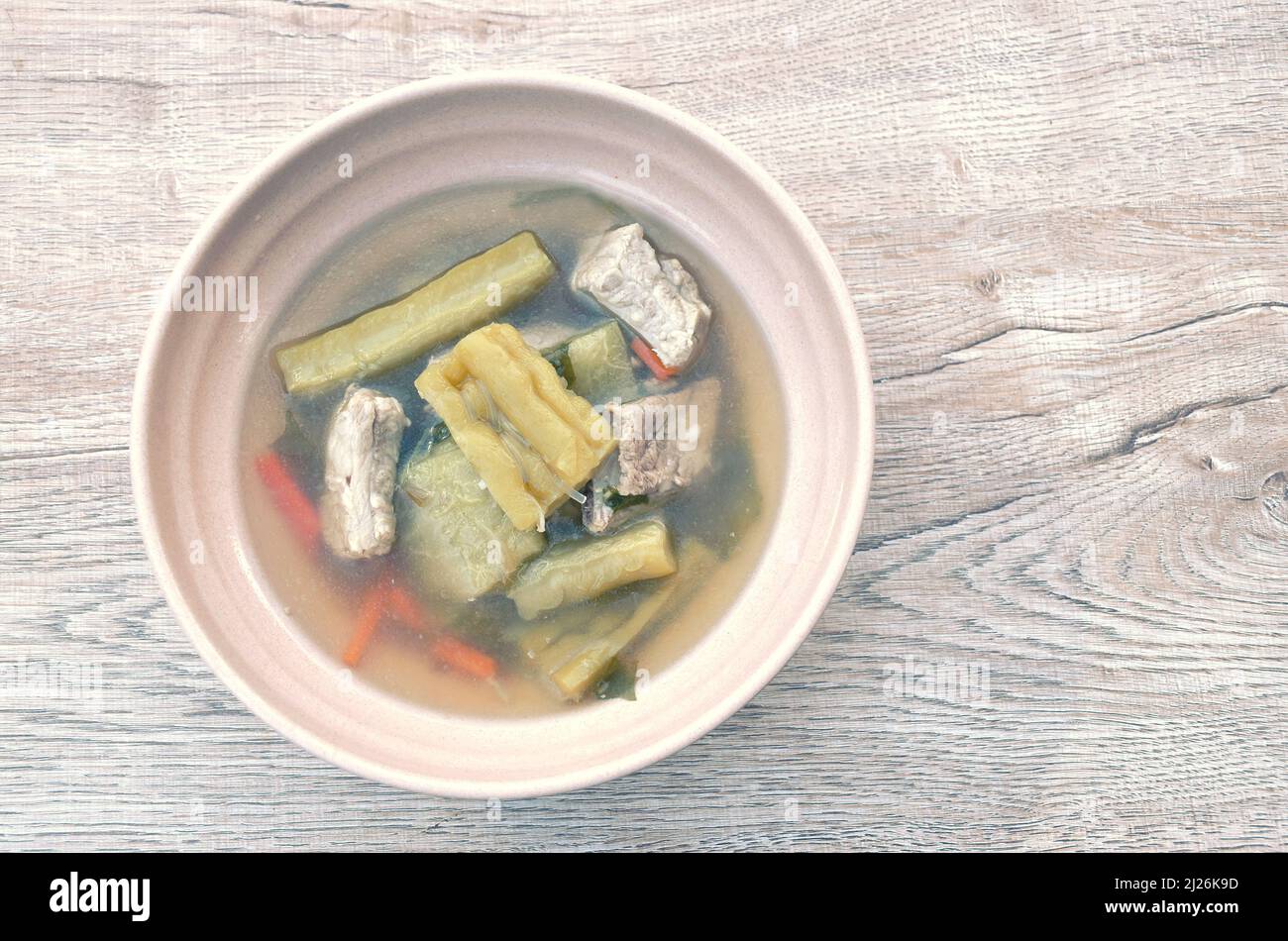 boiled bitter cucumber with pork bone in clear soup on bowl Stock Photo ...