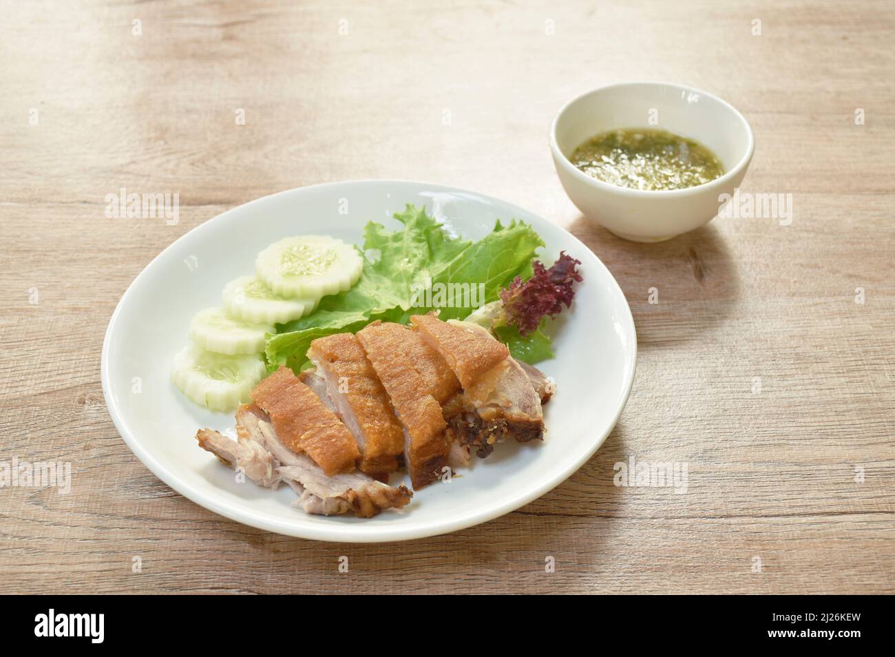 fried crispy slice pork leg with vegetable dipping spicy sauce Stock ...