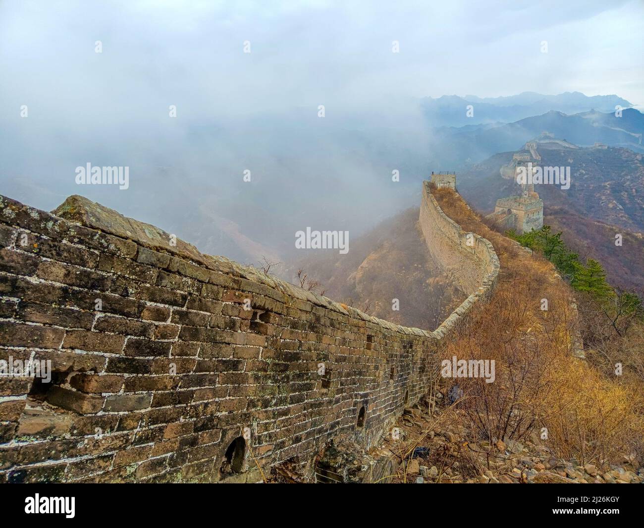 CHENGDE, CHINA - MARCH 30, 2022 - Clouds and fog cover the Jinshanling ...