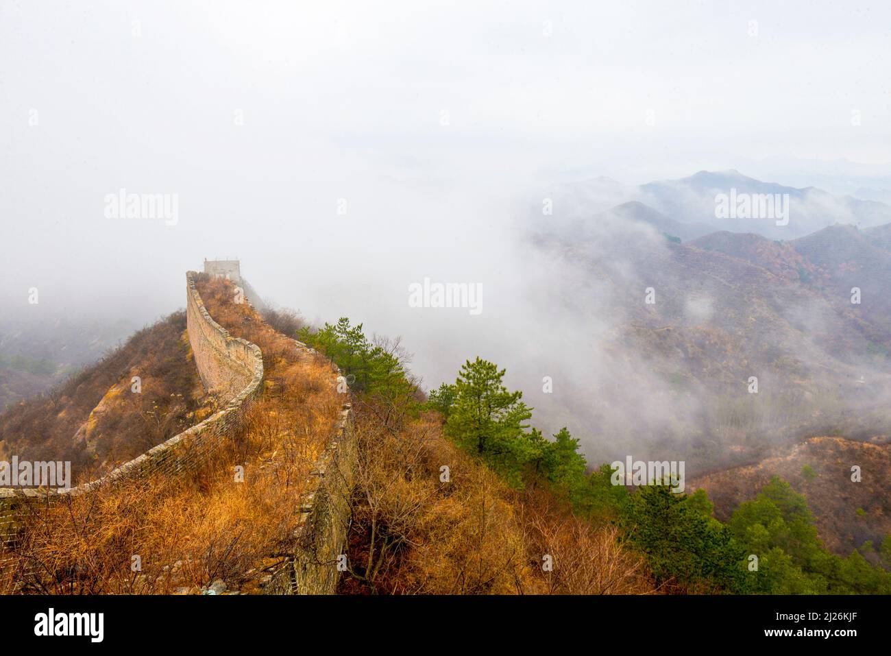 CHENGDE, CHINA - MARCH 30, 2022 - Clouds and fog cover the Jinshanling ...