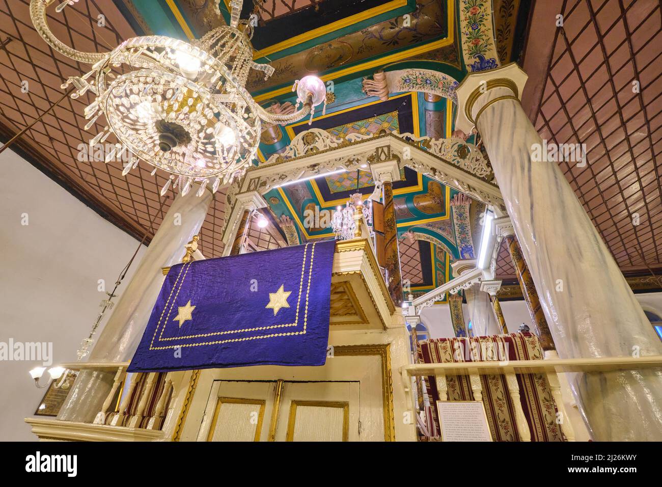 The centrally placed square bima at the Bikur Holim Jewish synagogue ...
