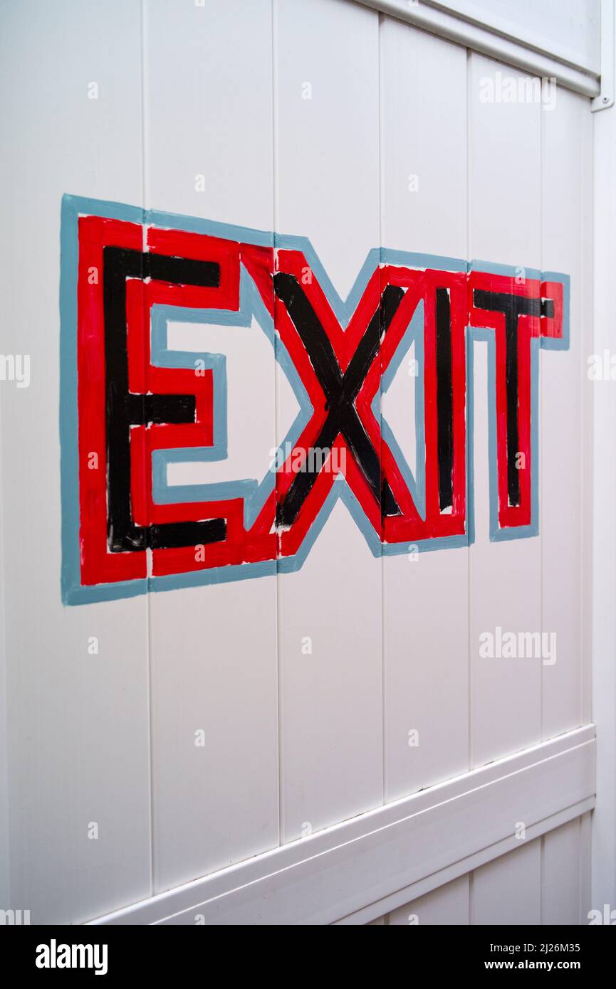 exit sign painted on a door Stock Photo - Alamy