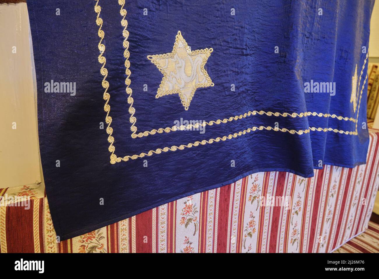 The detail of a Jewish, Star of David on a textile hanging from the ...
