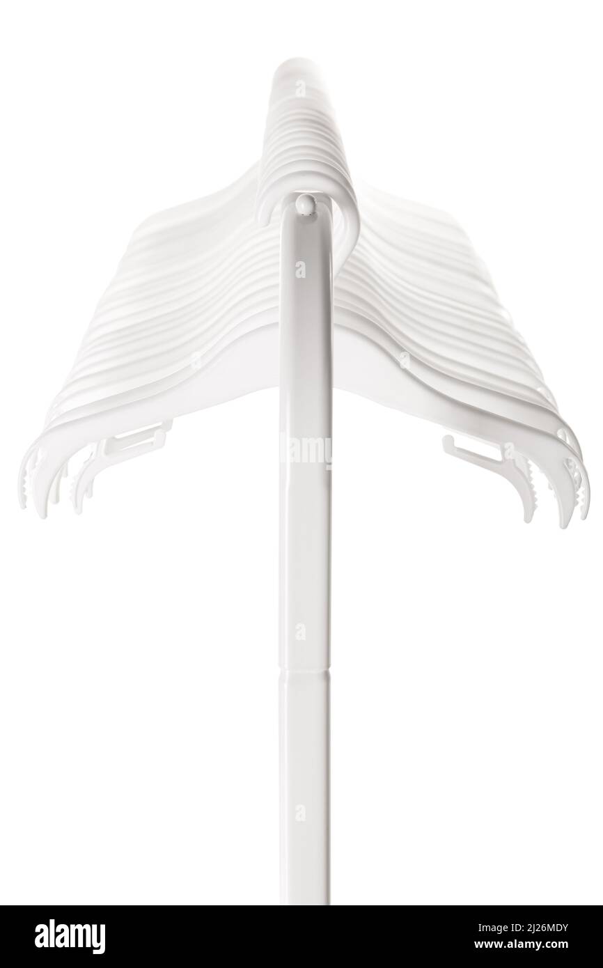 White plastic hangers for clothes hanging on rod from clothing rack ...