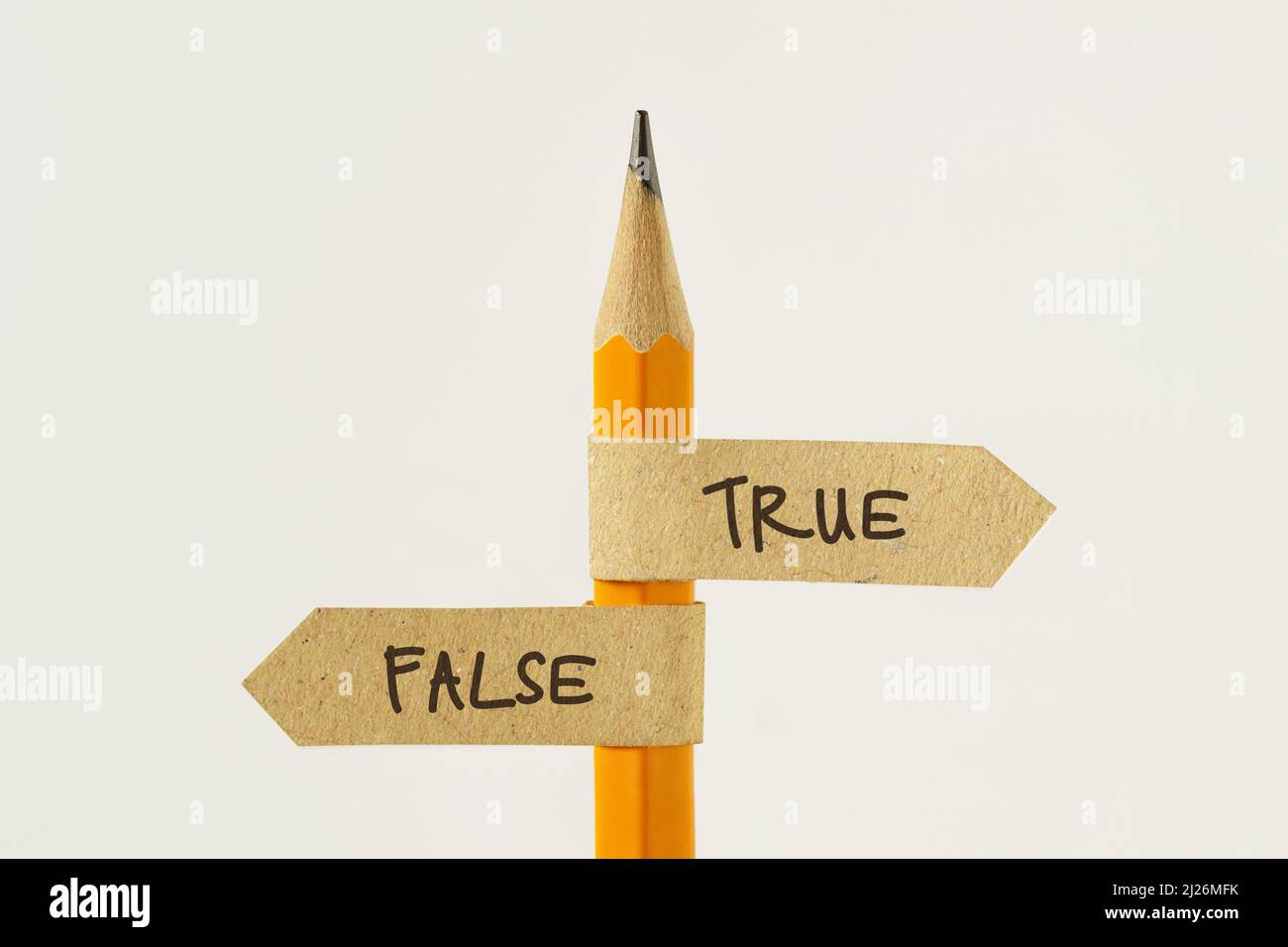 Pencil with true and false arrows Stock Photo - Alamy