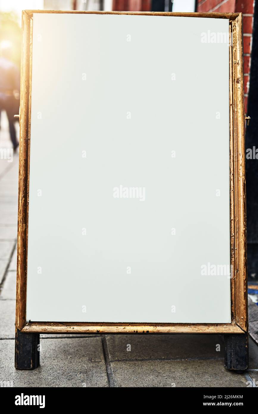 Dont walk pass it without reading it. Shot of a sidewalk sign with ...