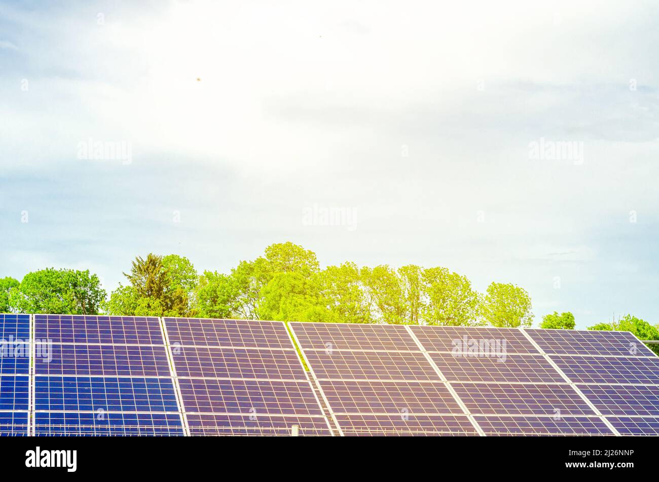 Solar panels under a cloudy sky. Solar energy. Innovative technologies ...