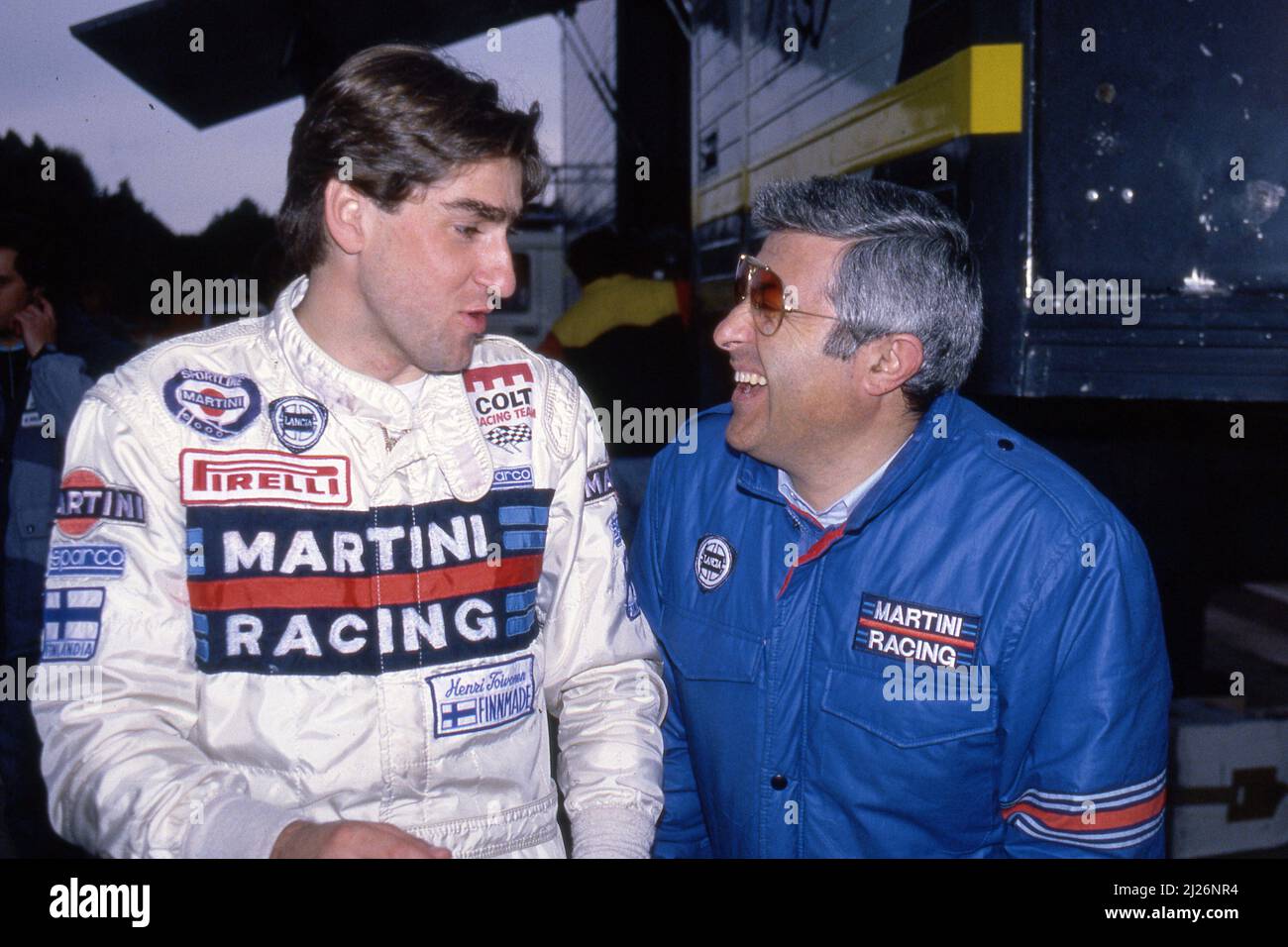 Henri Toivonen (FIN) Team Lancia Martini talks with NinI Russo Stock ...