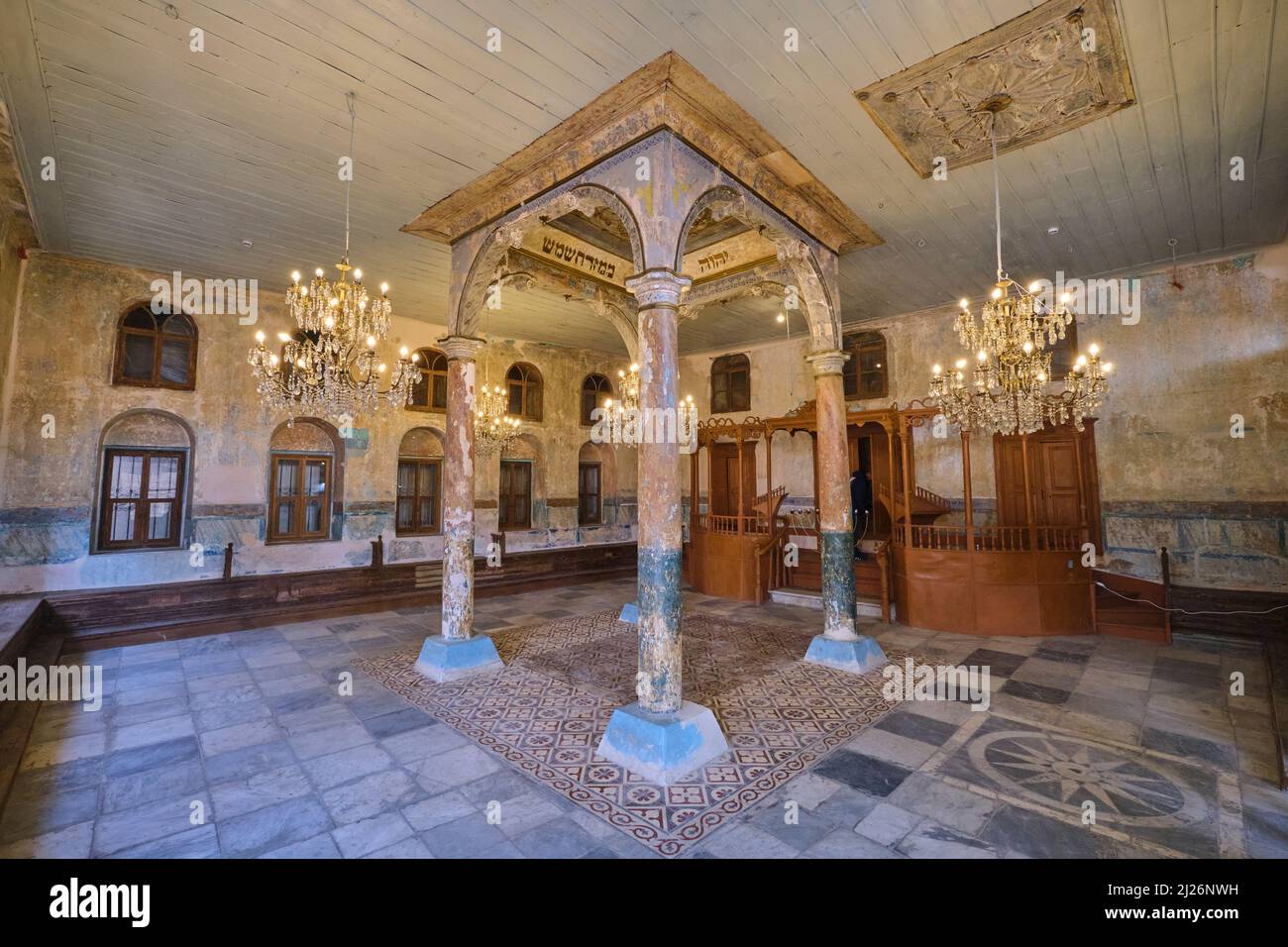 The synagogue space, with central bima. Restoration stripped past paint ...