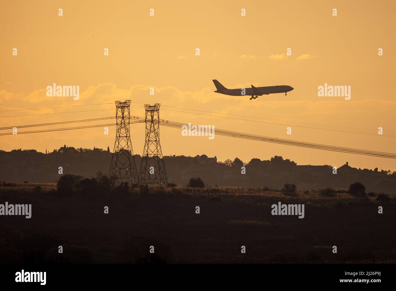 A South African airplane taking off and flying over the city of ...