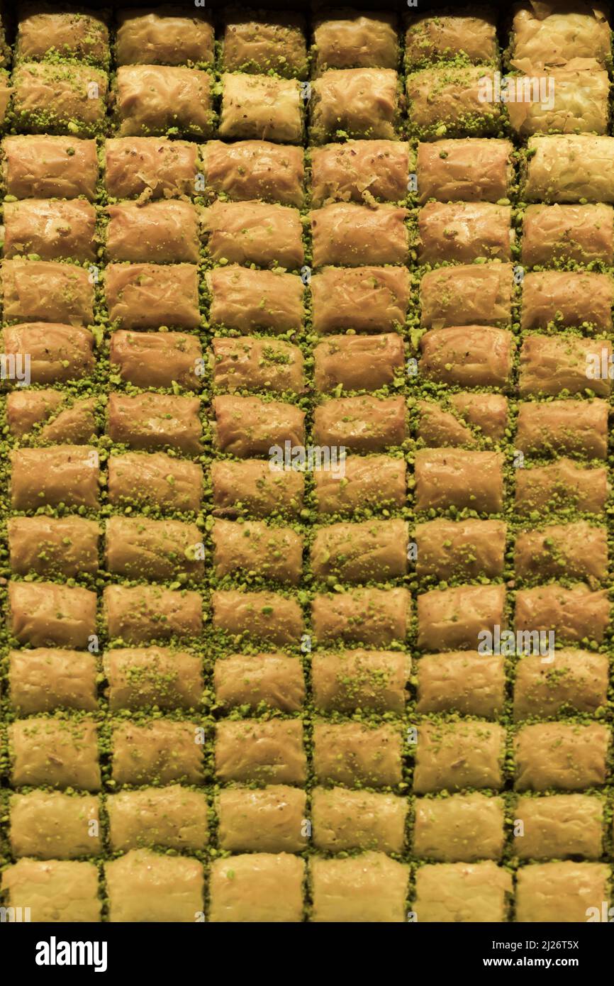 Top view of a perfectly cooked tray of Turkish kadayif with pistachio ...