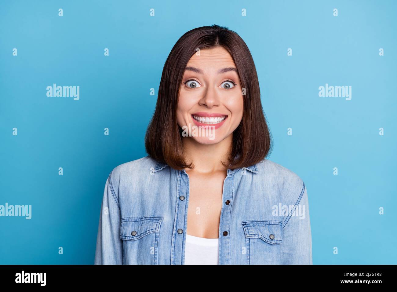 Photo of adorable sweet lady dressed denim shirt showing white teeth ...