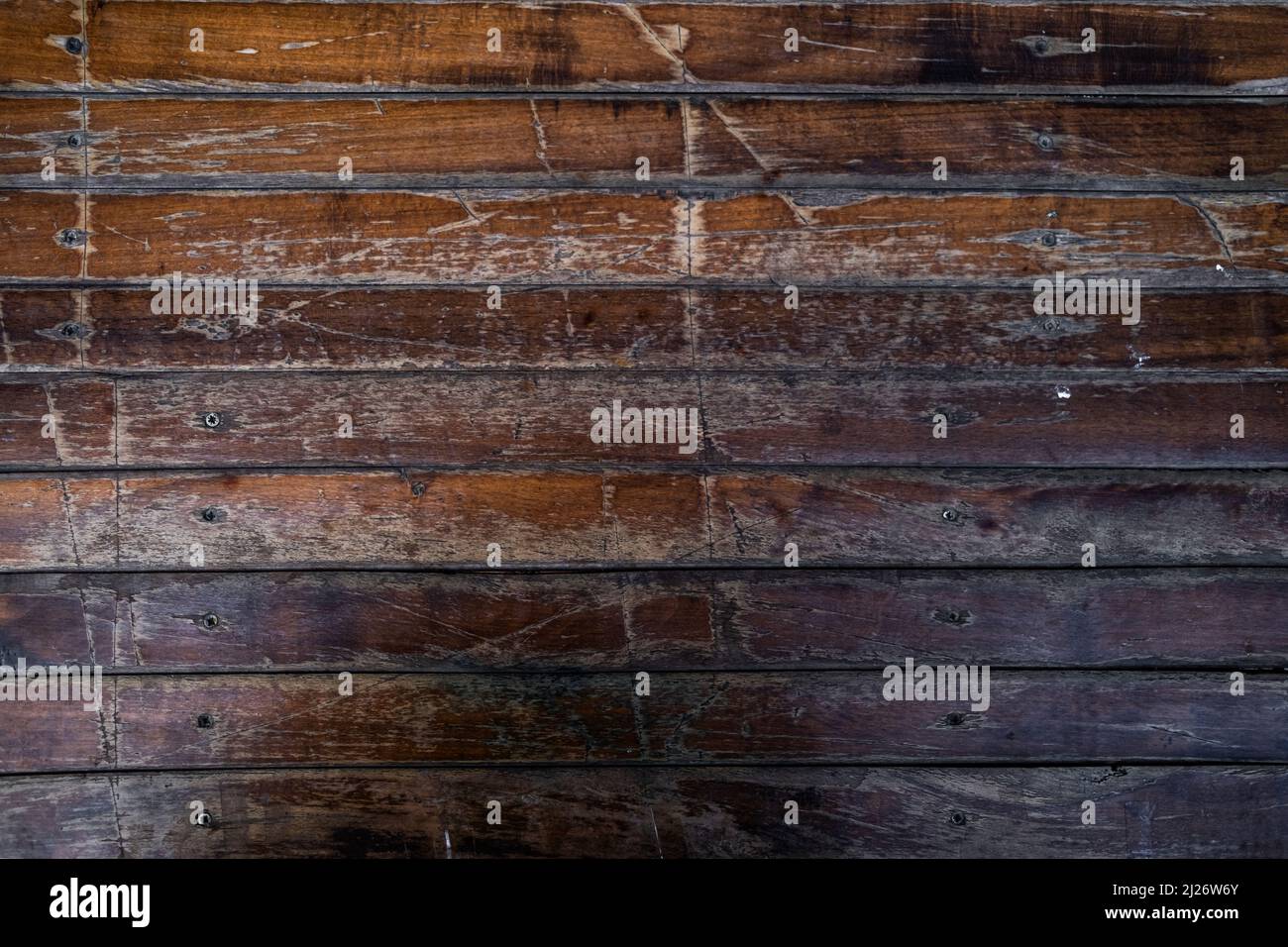 Texture map. Old wooden planks painted with brown paint cracked by a ...