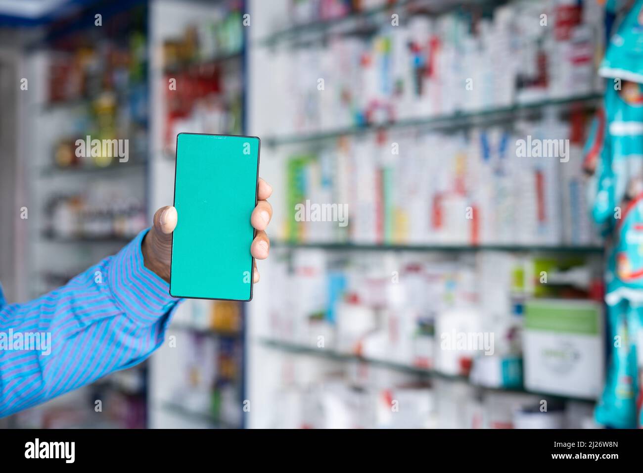 Indian mobile phone shop owner hi-res stock photography and images - Alamy