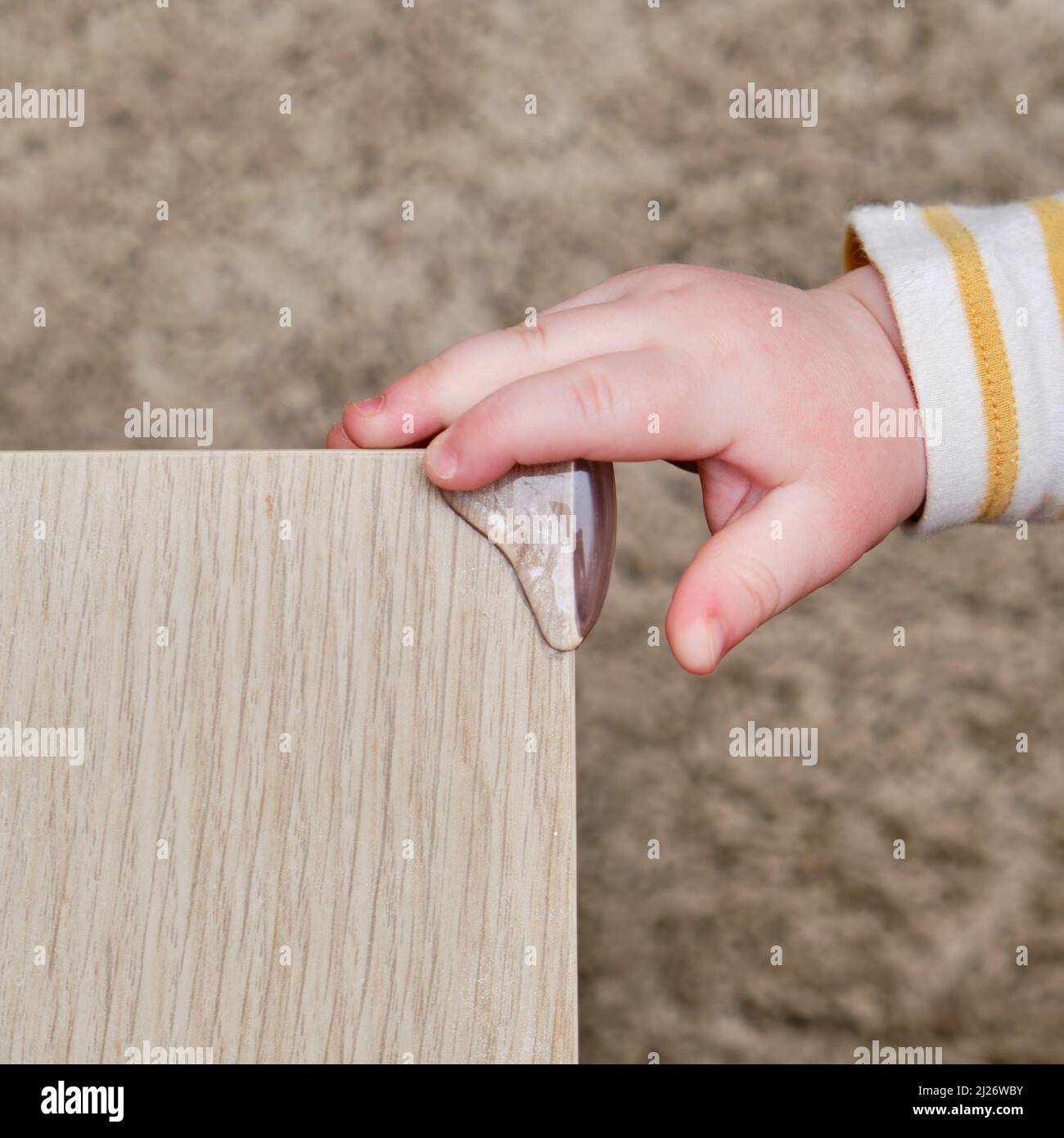 Danger for baby hit the corner of the table. Protect children from home ...