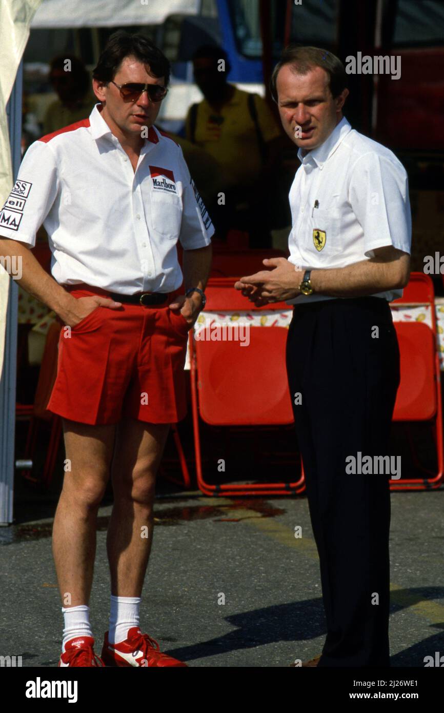 John Barnard (GBR) McLaren talks with Marco Piccinini (ITA) Ferrari ...