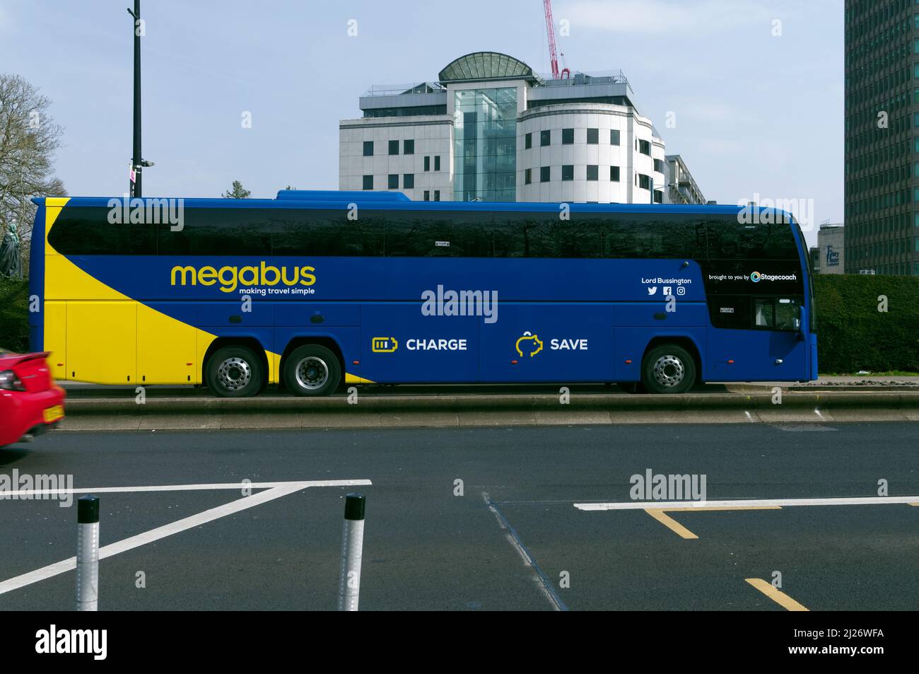 Megabus blue and yellow coach parked at a bus stop on Kingsway, Cardiff ...