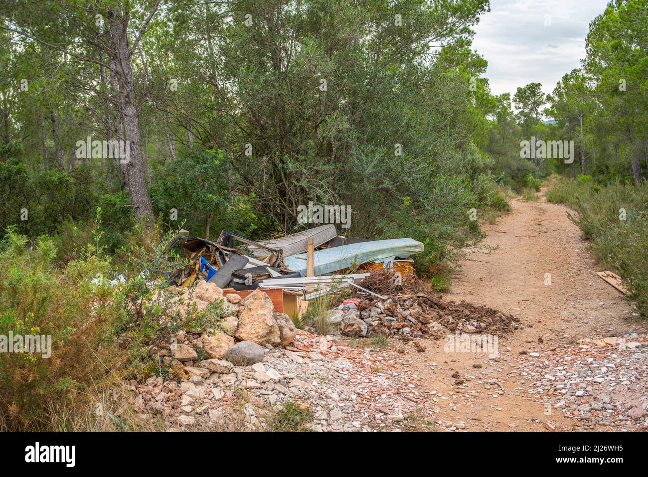 Rubble garbage in lying in forest at a rural road in Tarragona, Costa ...