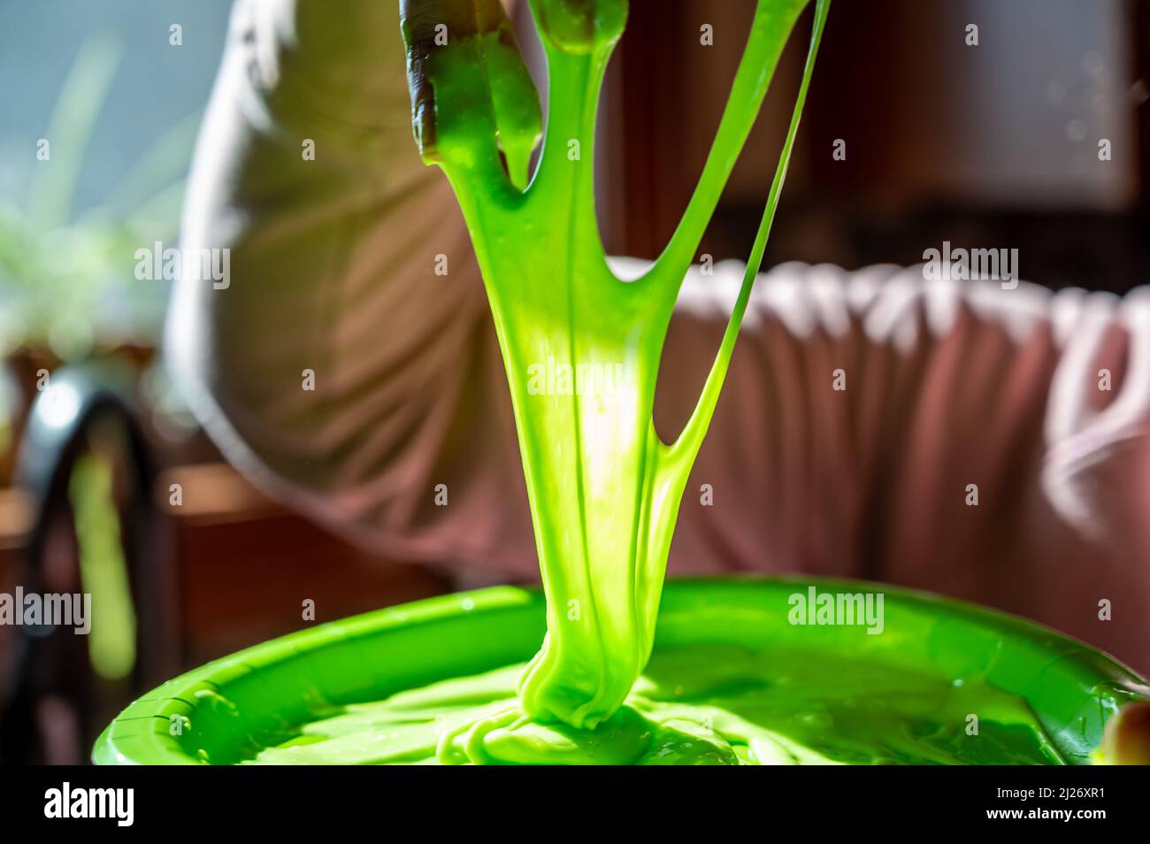 focus on slime covered hands with strings of gooey webbing down Stock ...