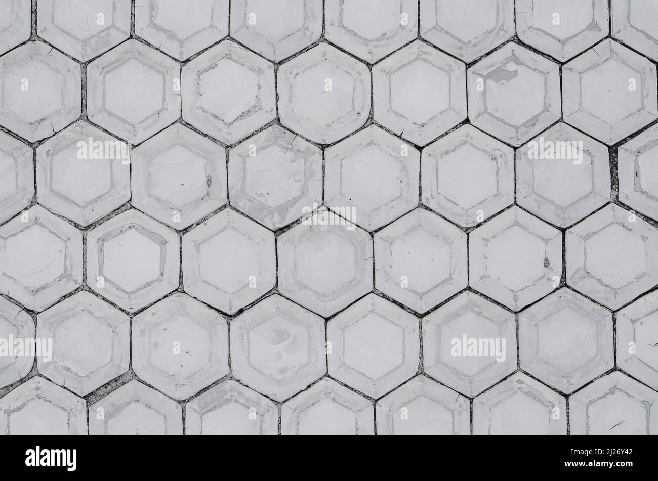 Wall with concrete honeycombs. Concrete gray hexagonal tiles, honeycomb ...