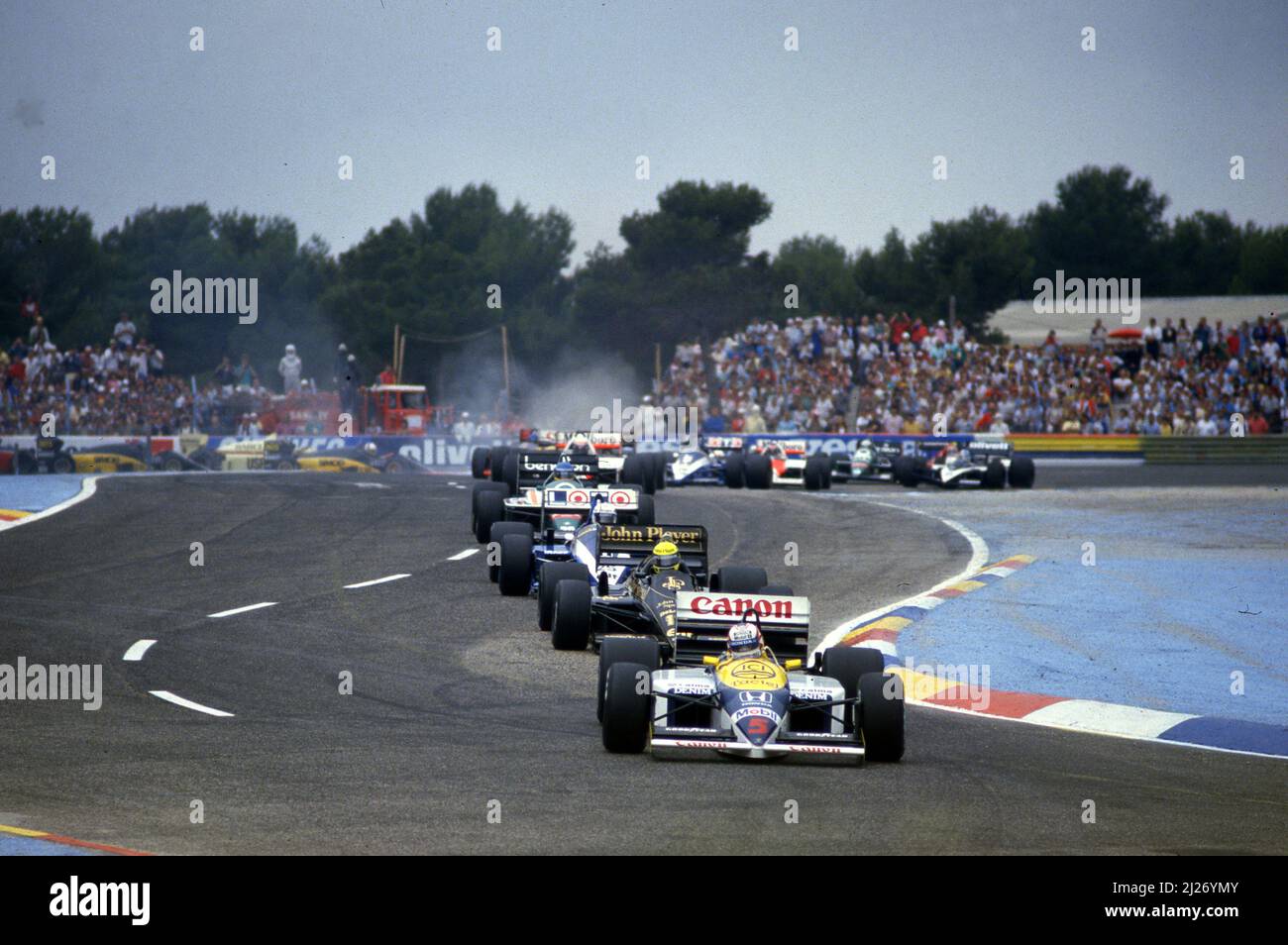 Nigel Mansell (GBR) Williams FW11 Honda 1st position leads a group Stock Photo - Alamy