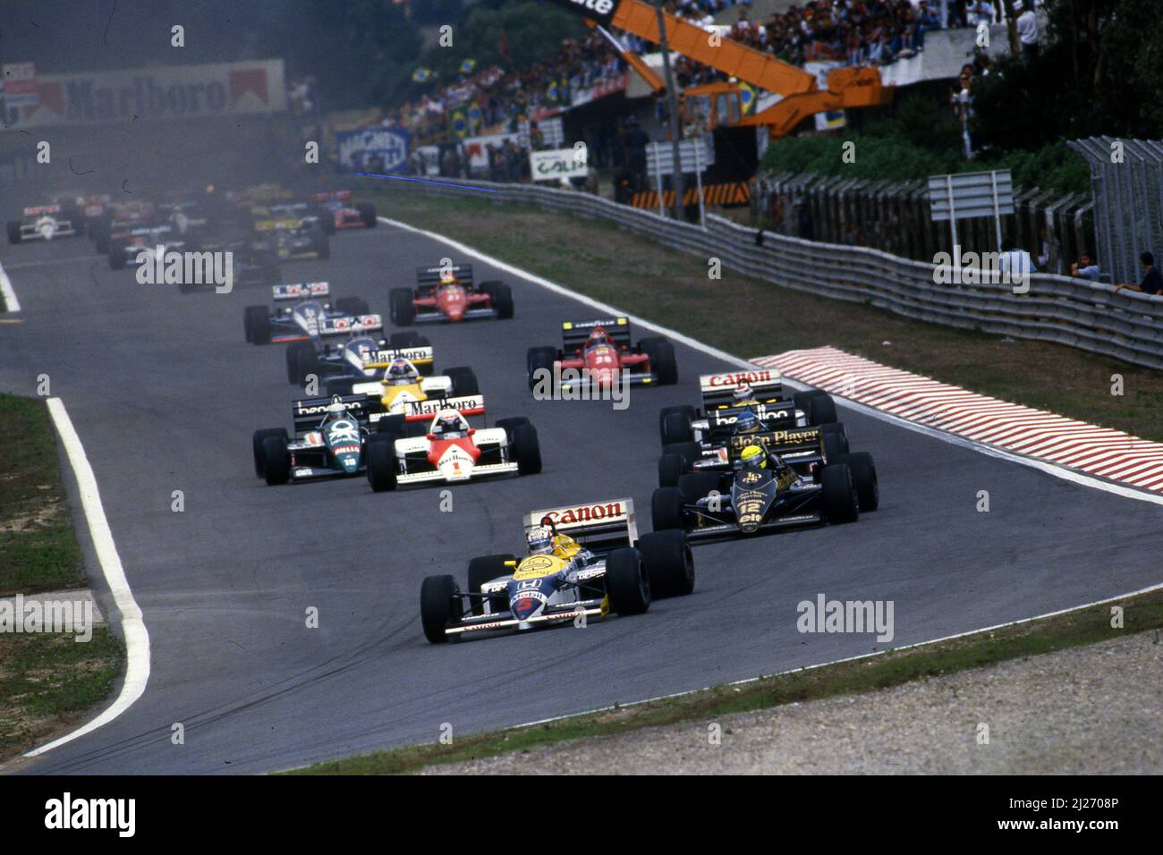 Nigel Mansell (GBR) Williams FW11 Honda 1st position leads the group at start Stock Photo - Alamy