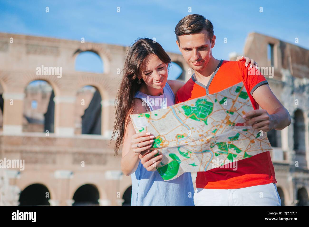 Happy family in Rome over Coliseum background on italian european ...
