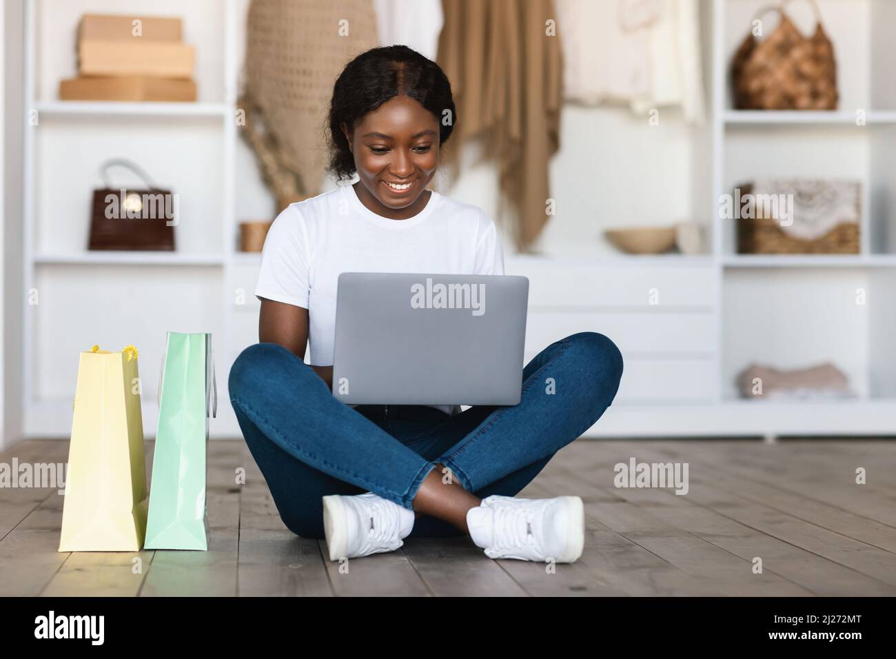 Happy Black Female Using Laptop Shopping Buying Clothes Online Indoor Stock Photo - Alamy