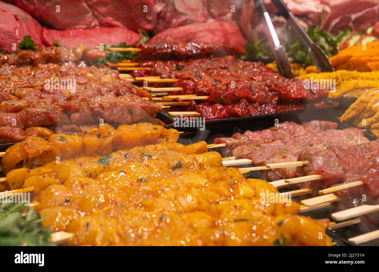 Showcase with a variety of raw meat Dishes Stock Photo - Alamy